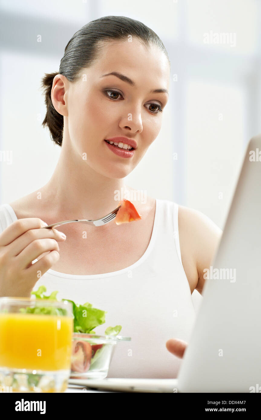 A beautiful slender girl eating healthy food Stock Photo - Alamy