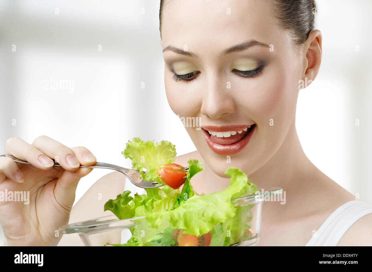A beautiful slender girl eating healthy food Stock Photo - Alamy