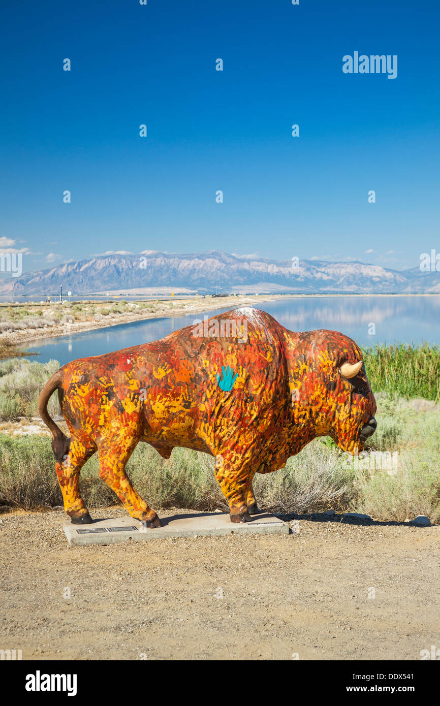 Painted buffalo statue on Antelope Island with the Great Salt Lake in ...
