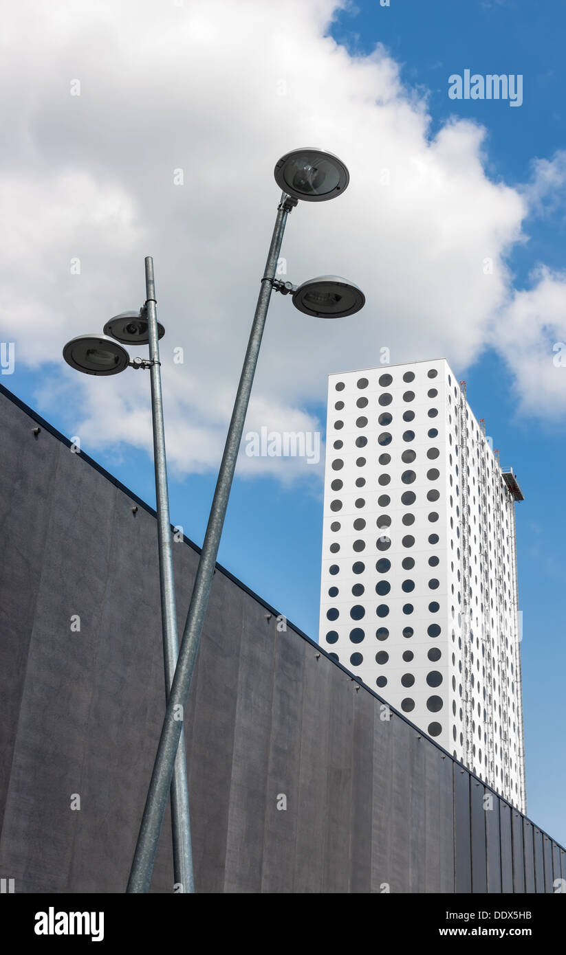 Modern urban architecture. Building with round windows and streetlights ...