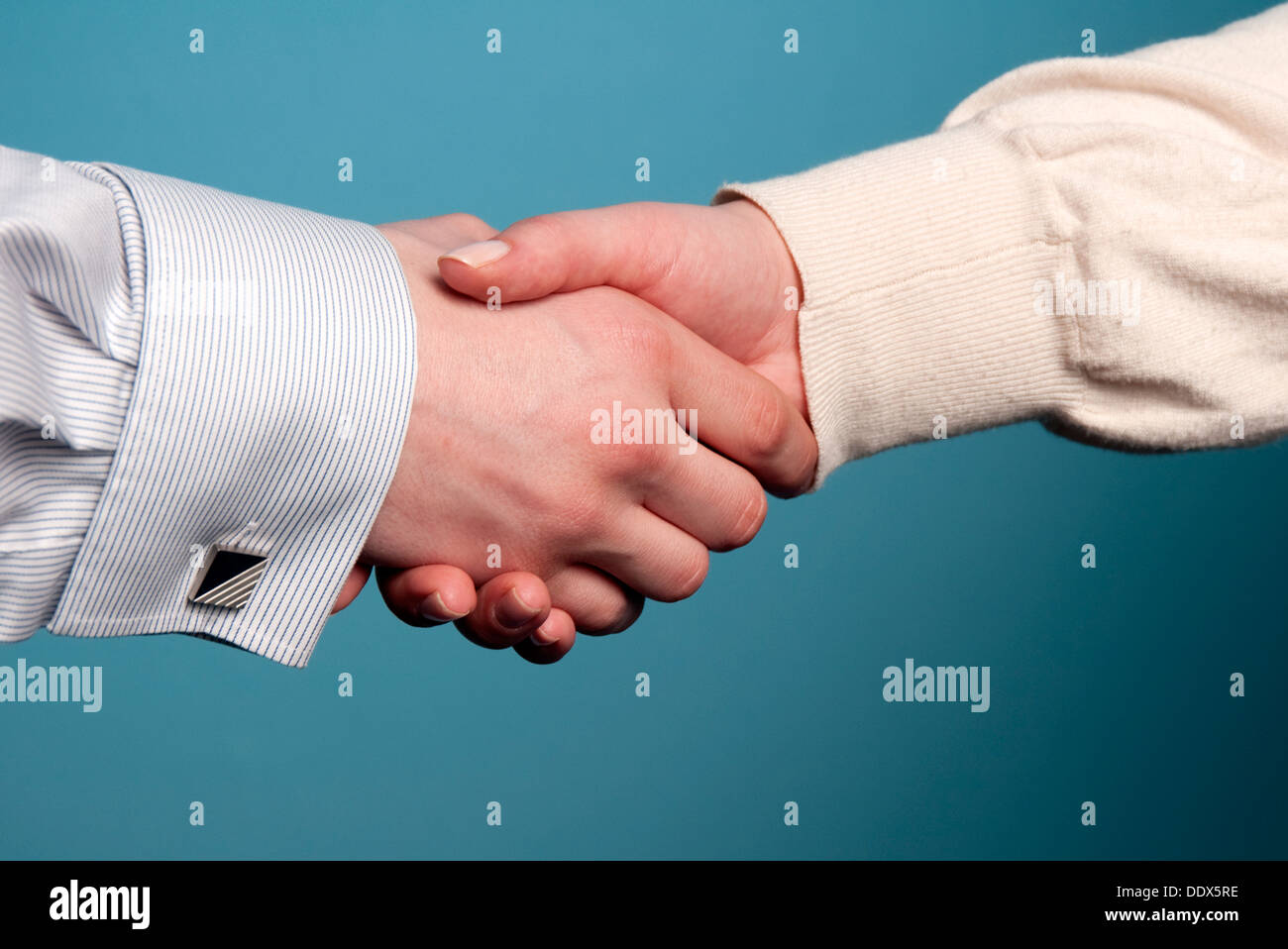 two people shaking hands. Male and female Stock Photo - Alamy