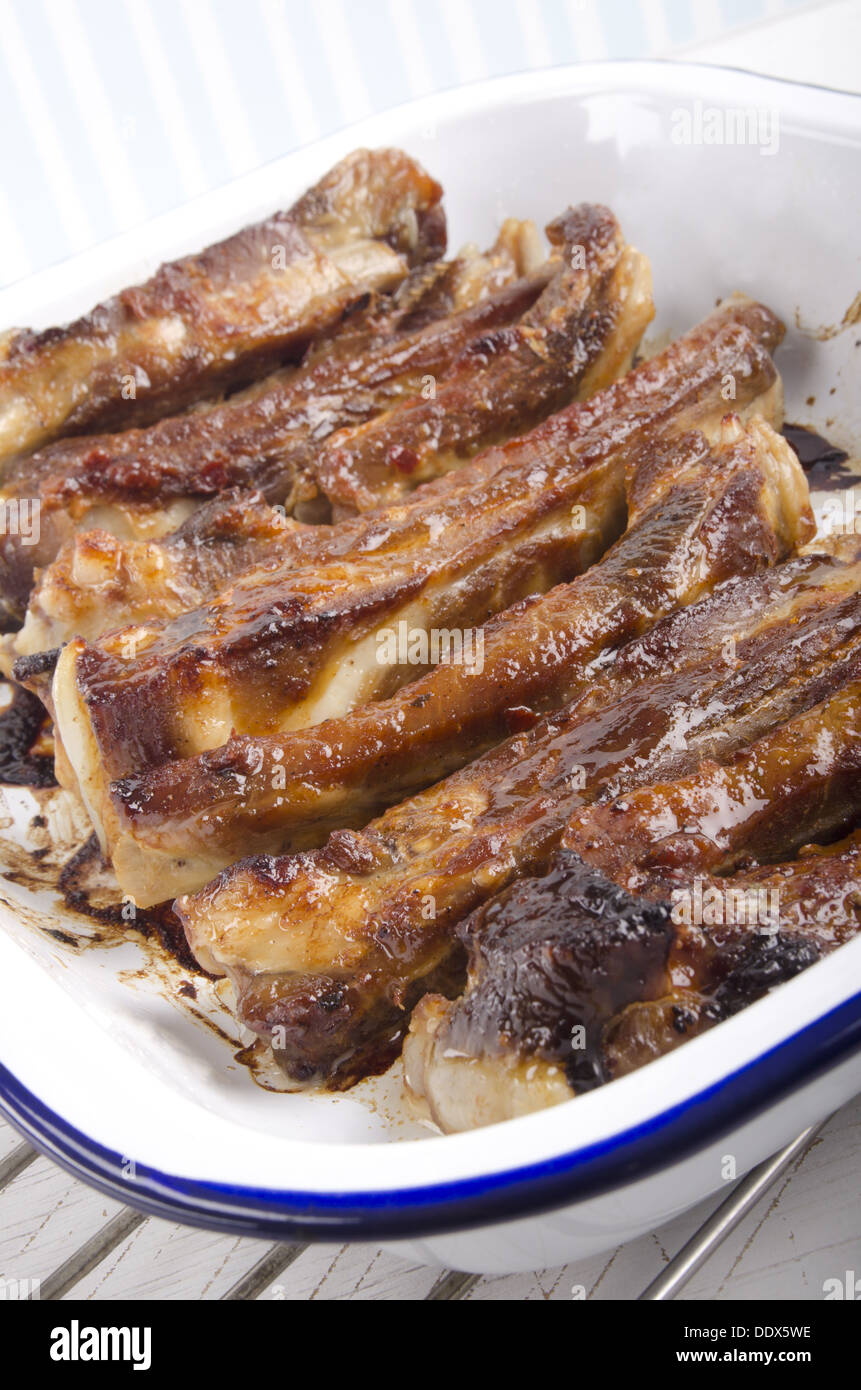 grilled pork ribs in an enamel bowl Stock Photo - Alamy