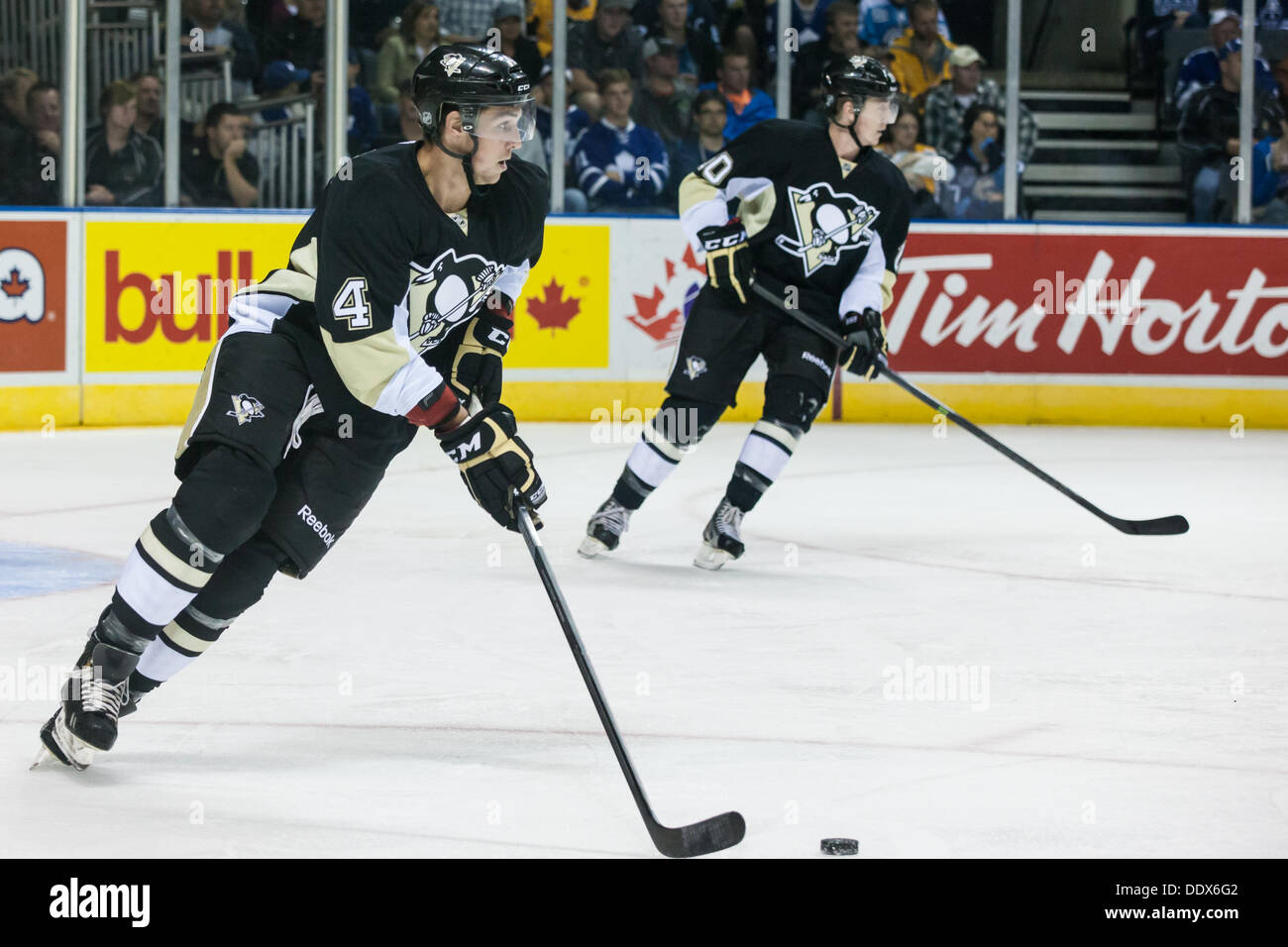 Clark Seymour (4) of the Penguins carries the puck during a game ...