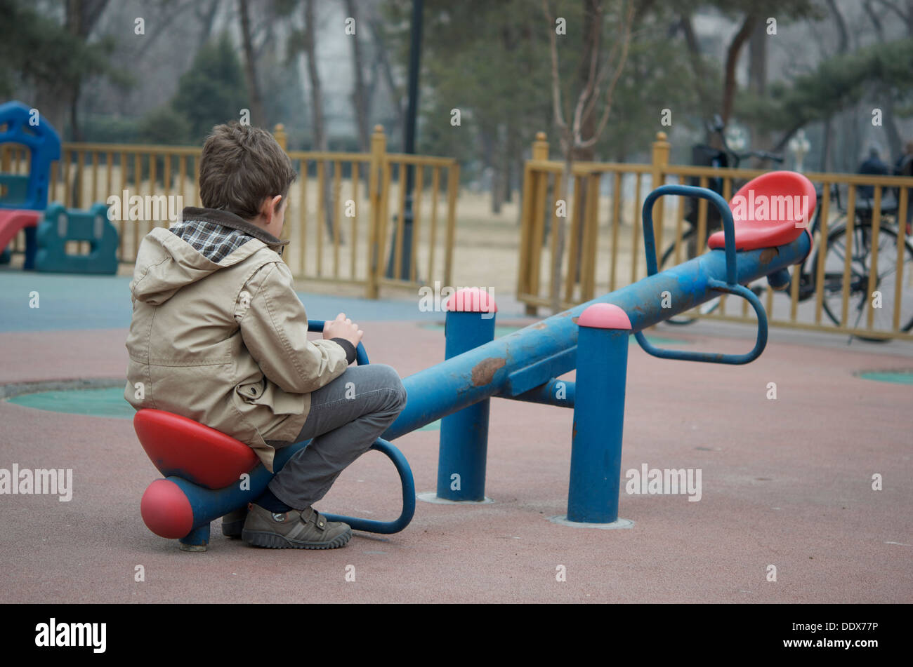 Child Alone In Playground