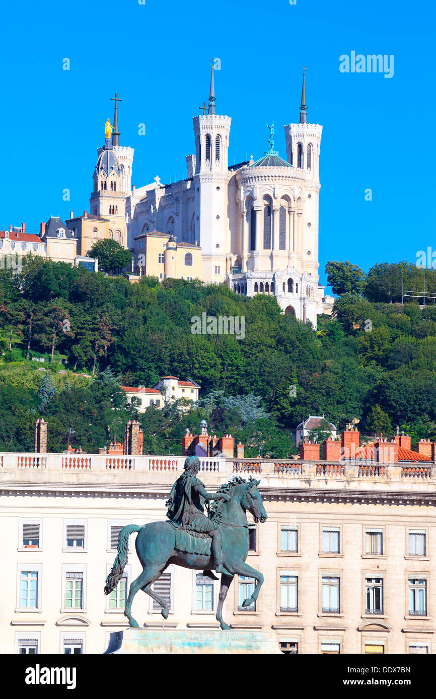 Statue of Louis XIV and basilica in Lyon city Stock Photo - Alamy