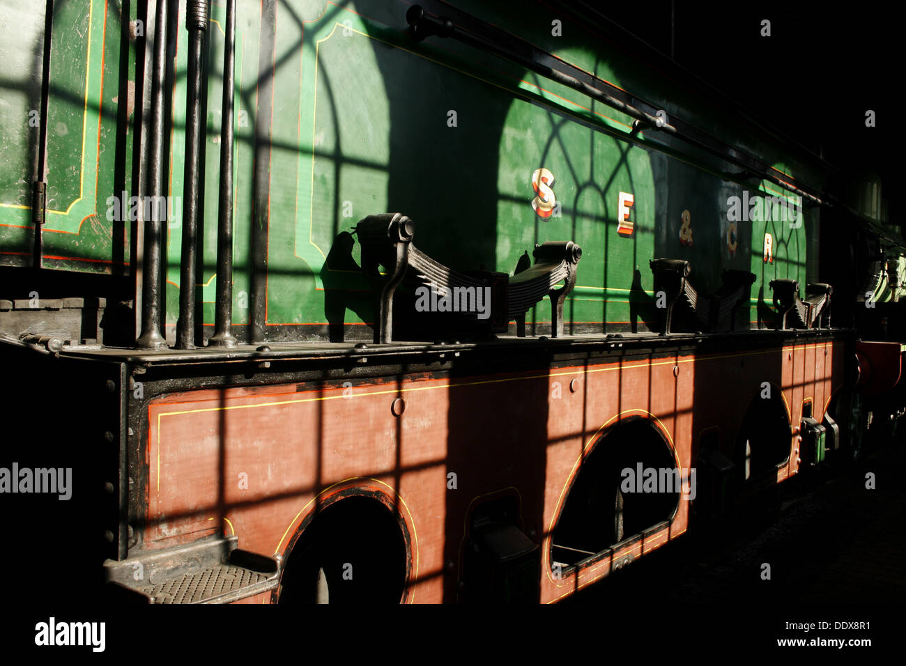 Old railway engine in locomotive sheds at Bluebell Railway Stock Photo ...