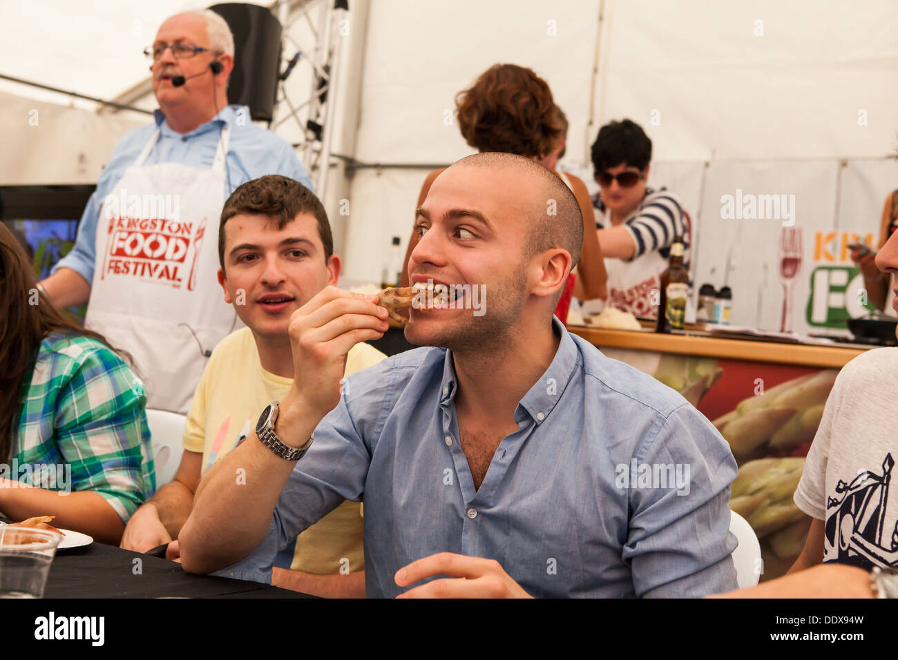 Extreme Food Challenge Kingston 2013 - eating chicken's feet Stock ...