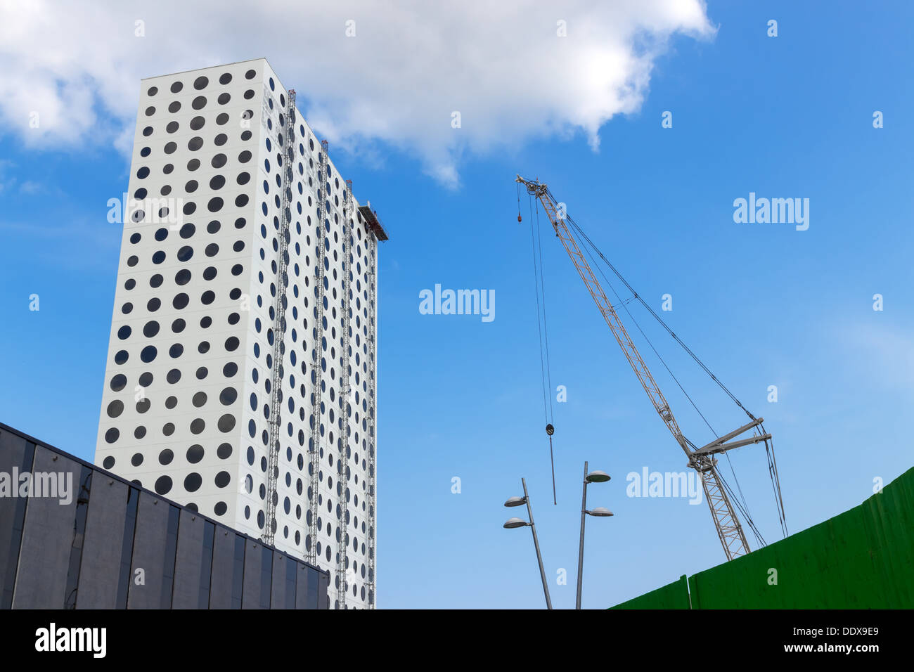 White futuristic building with round windows, under construction Stock ...