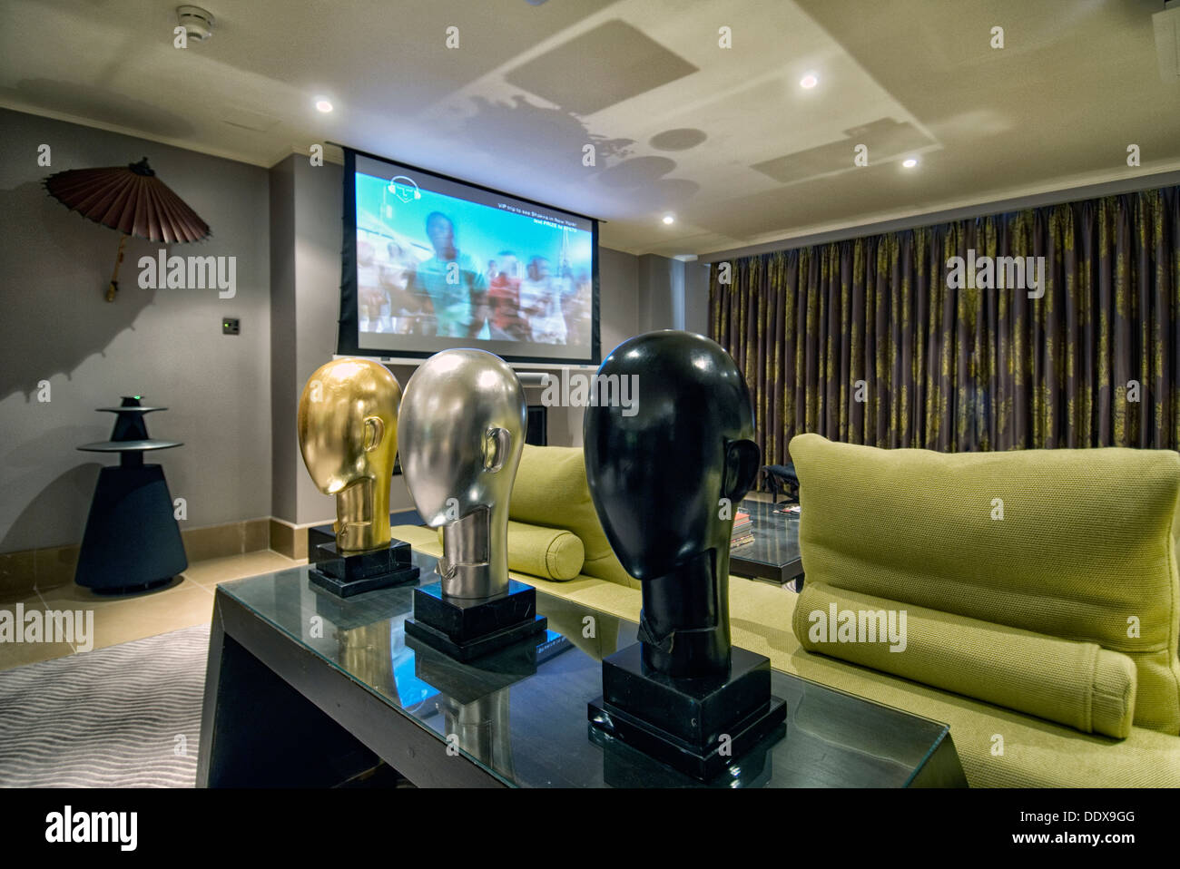 modern sitting room with TV projector and screen Stock Photo - Alamy