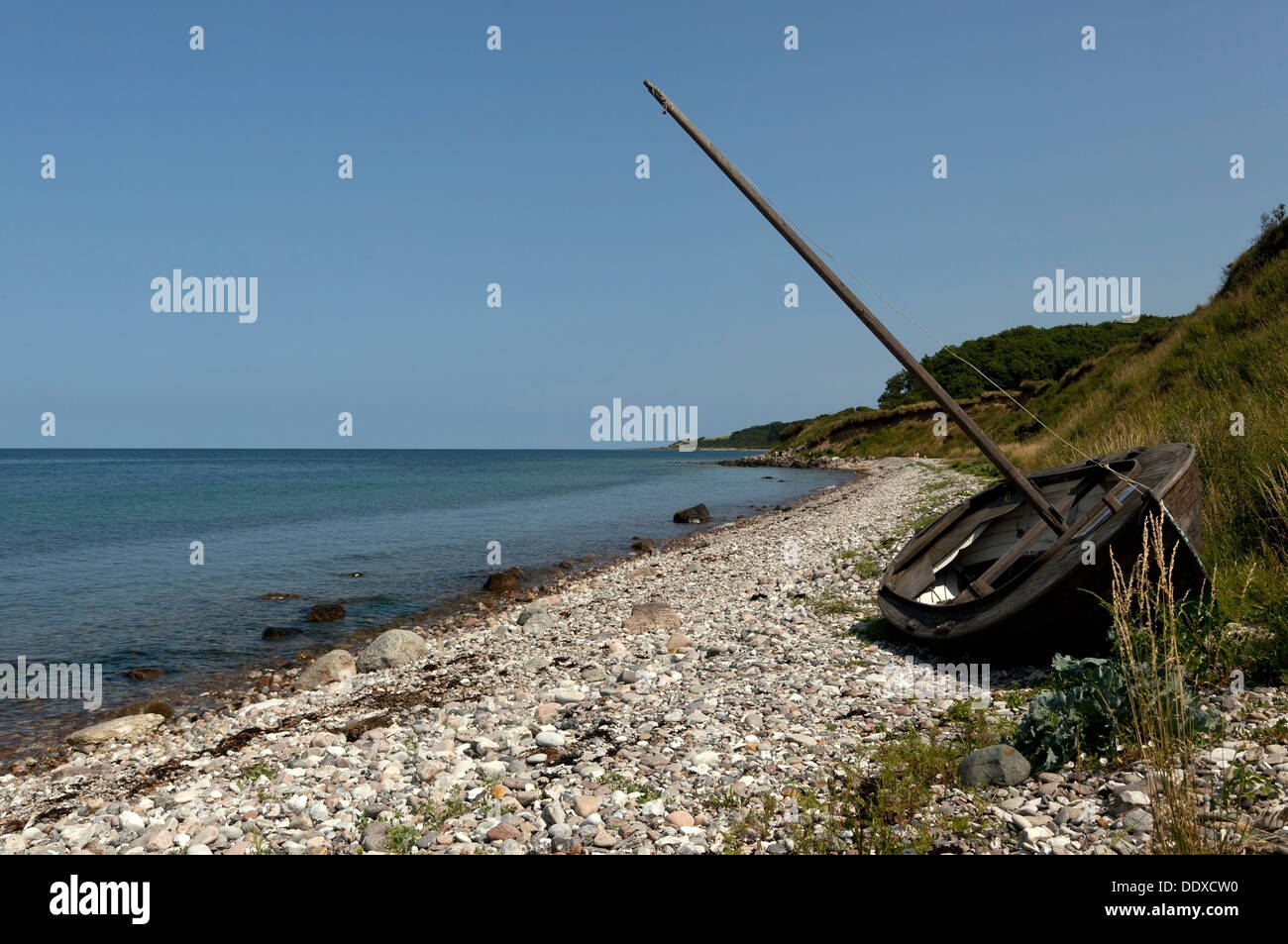 Stranded boat at shore at the stretch of coast at Roesnaes near ...