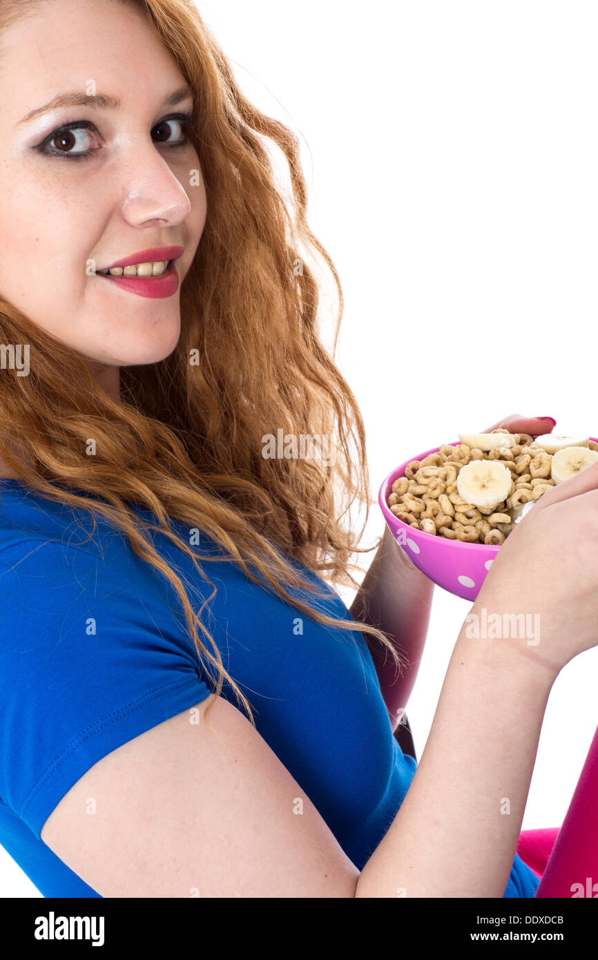 Model Released. Attractive Young Woman Eating Breakfast Cereals Stock ...