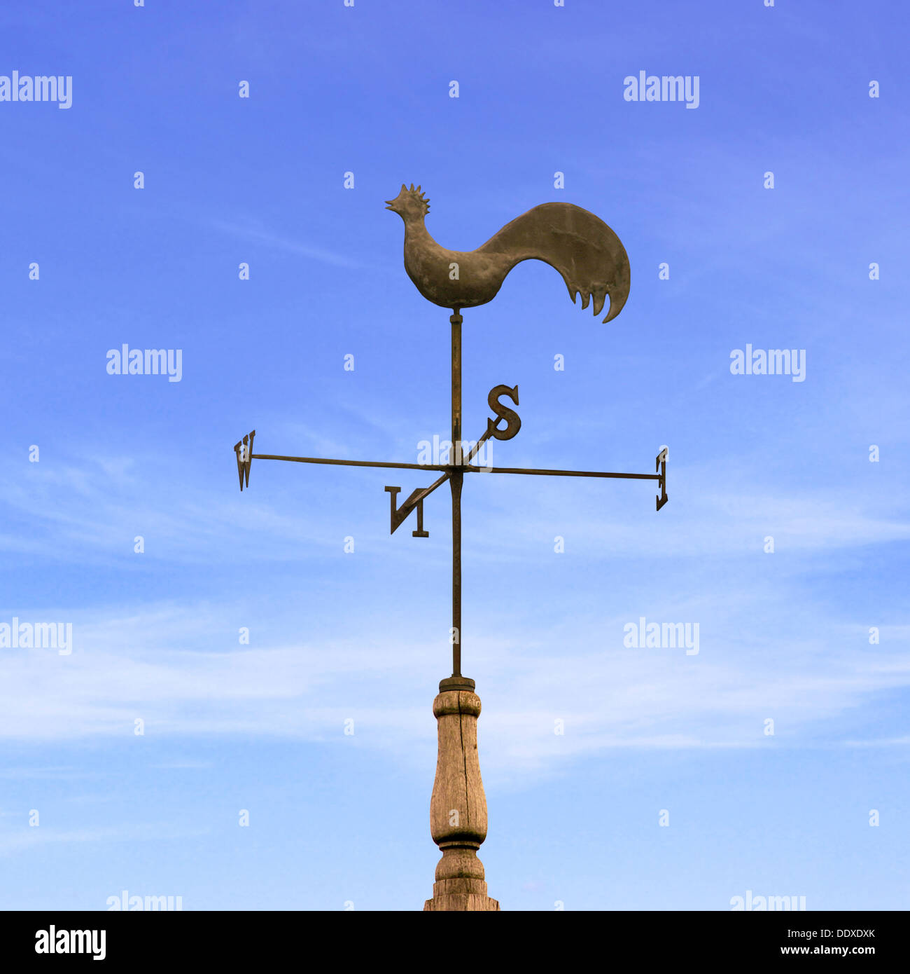 An Old Rooster Weather Vane with Blue Sky Stock Photo - Alamy