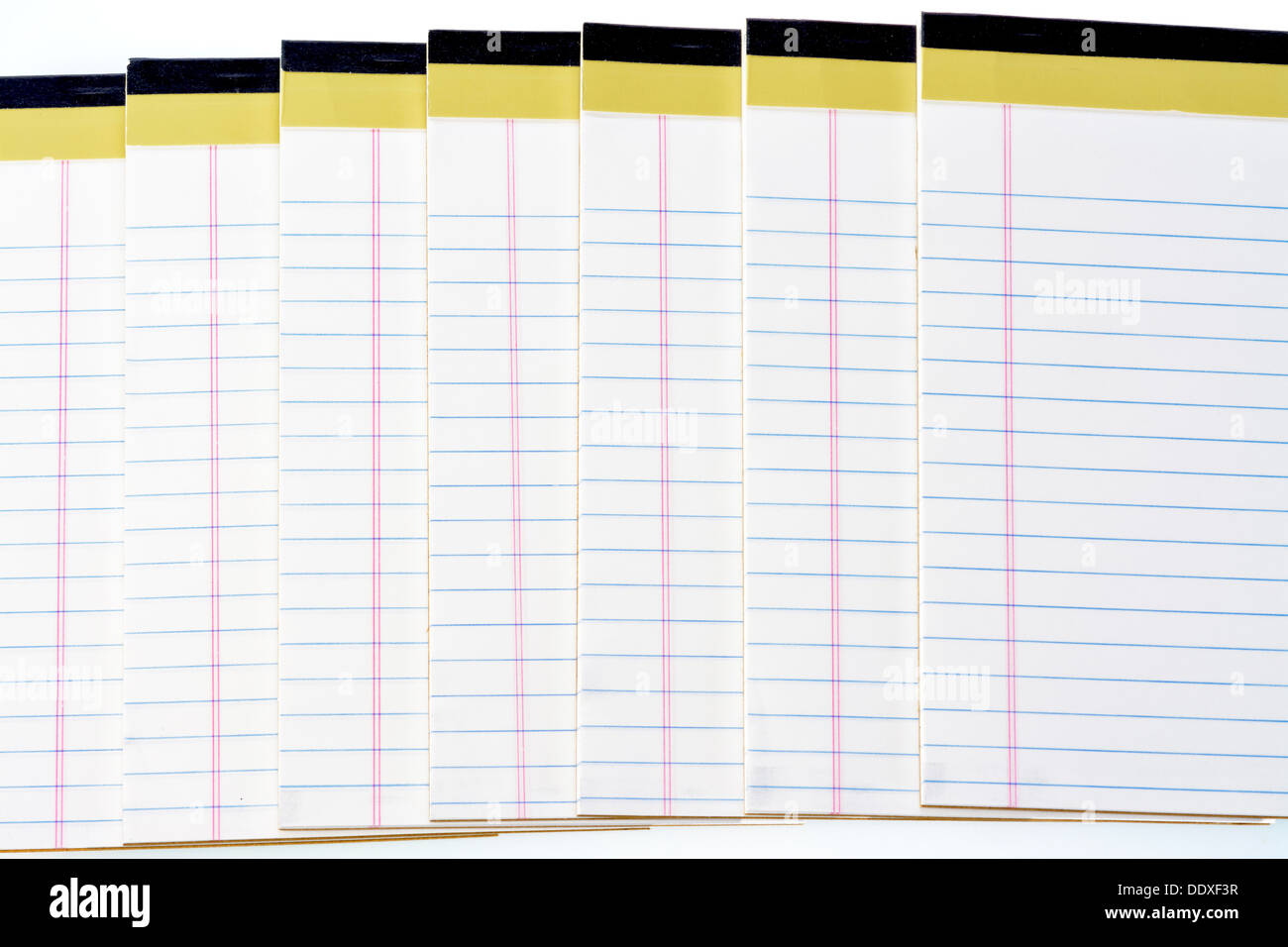 Small tablets of paper lined up n a row Stock Photo - Alamy