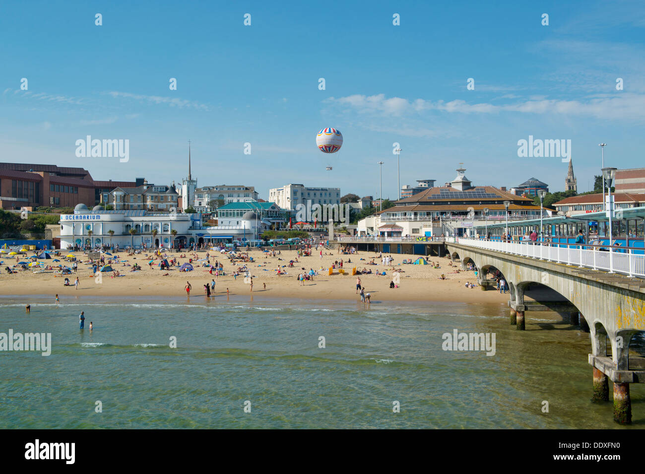 A wide shot of Bournemouth beach taken from the pier during summer in ...