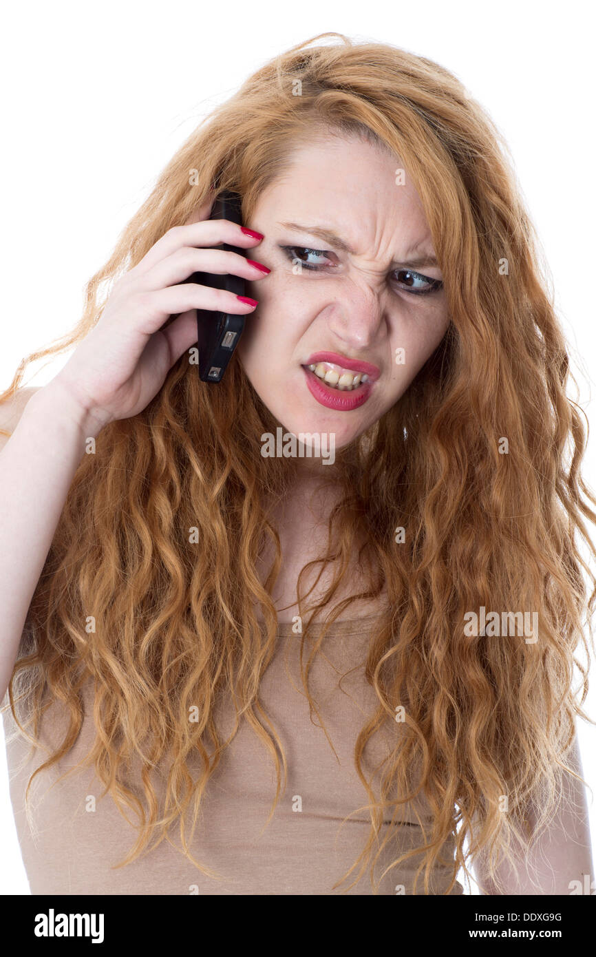 Model Released. Angry Young Woman Using Mobile Telephone Stock Photo ...