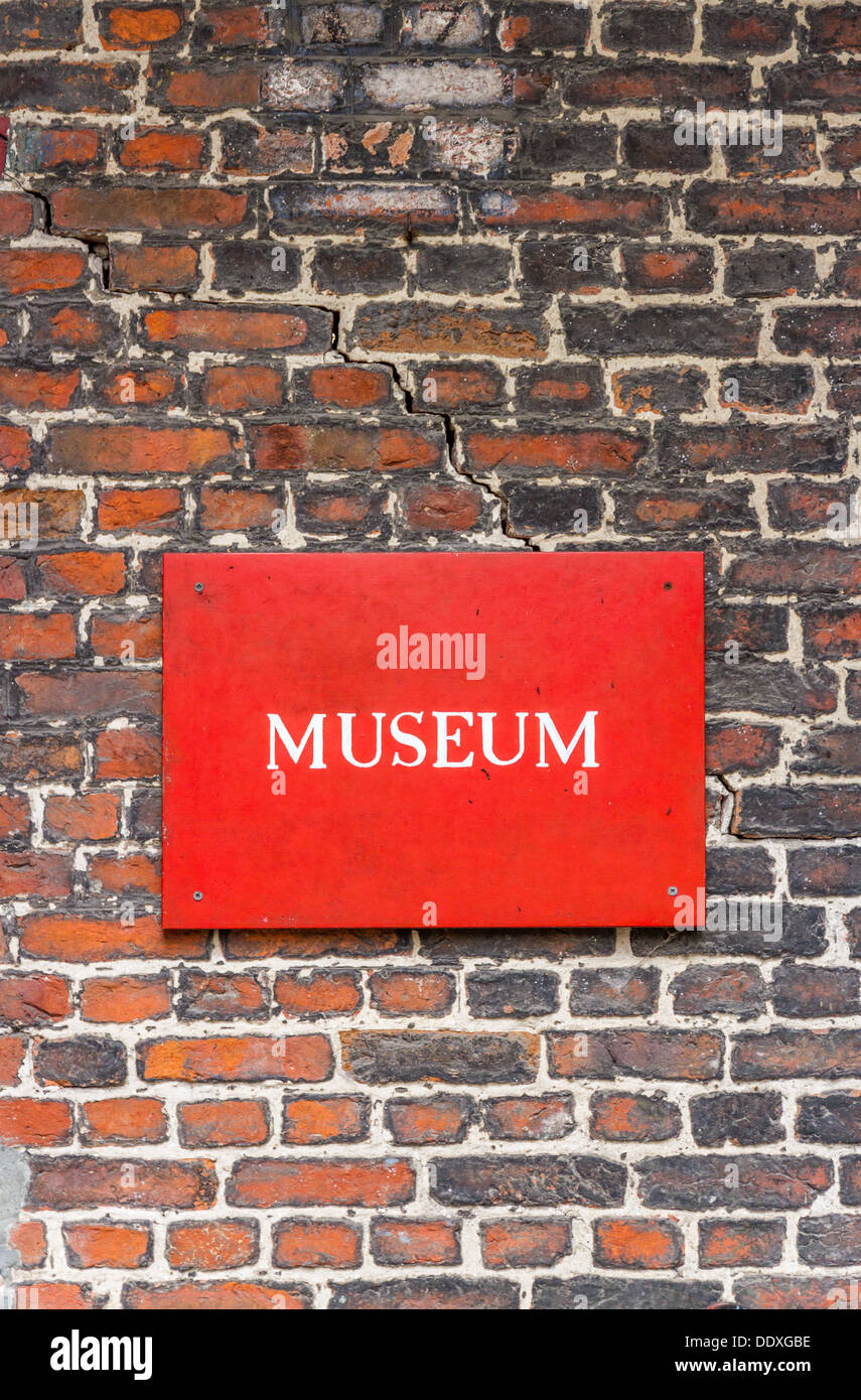 Red Museum Sign attached to a brick wall Stock Photo - Alamy