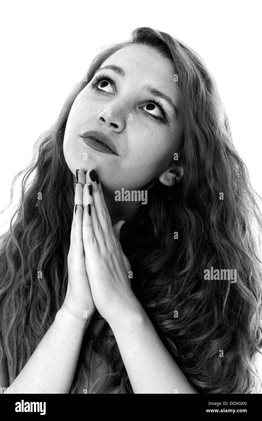 Model Released. Attractive Young Woman Praying Stock Photo - Alamy