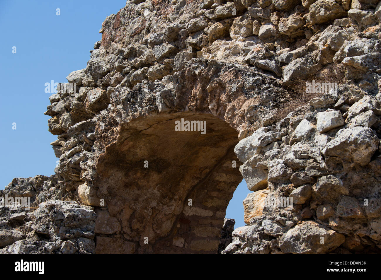 An arched doorway in the ruins of the city of Aptera in northern Crete ...