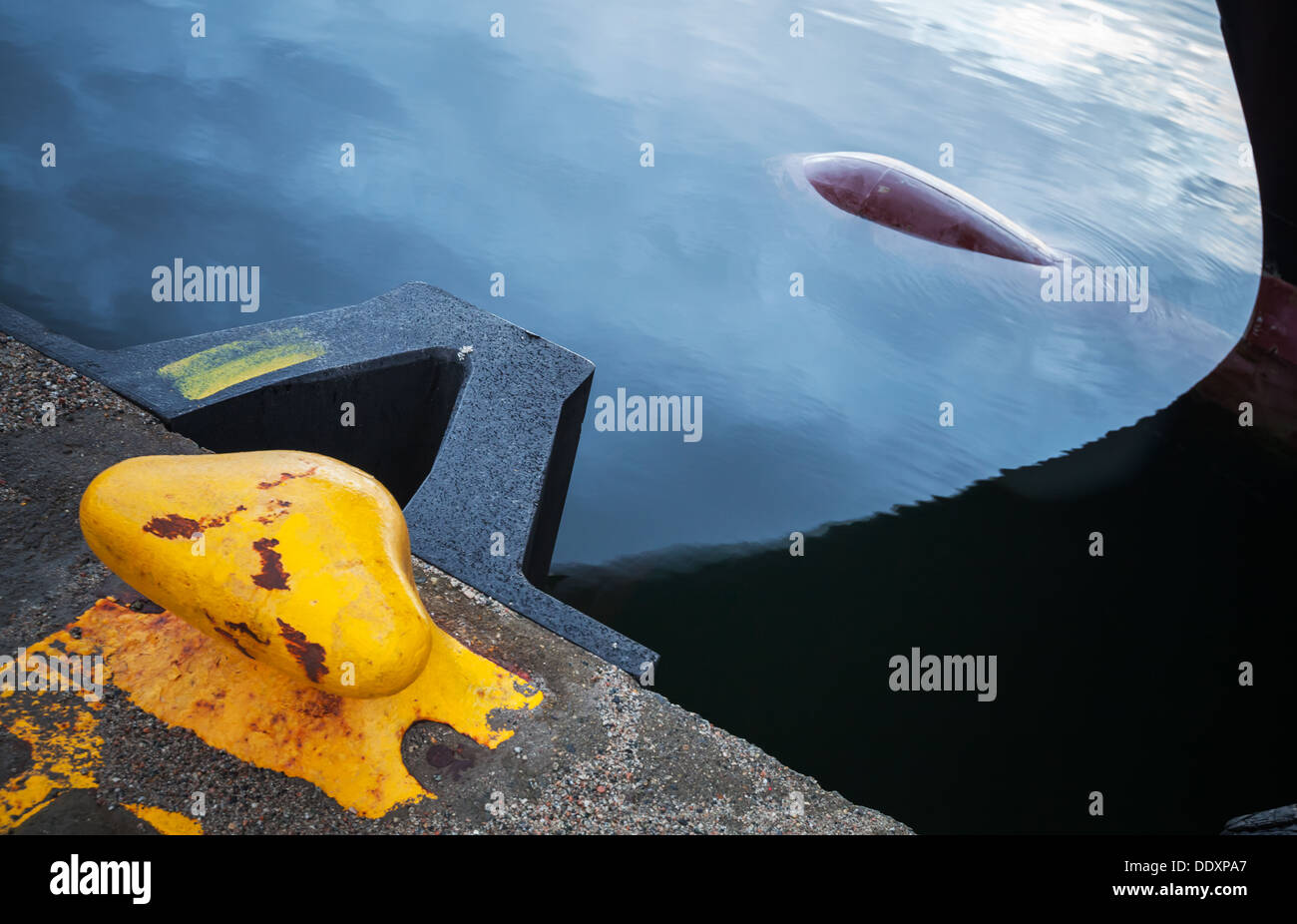 Abstract port fragment with yellow bollard and ship bow Stock Photo - Alamy