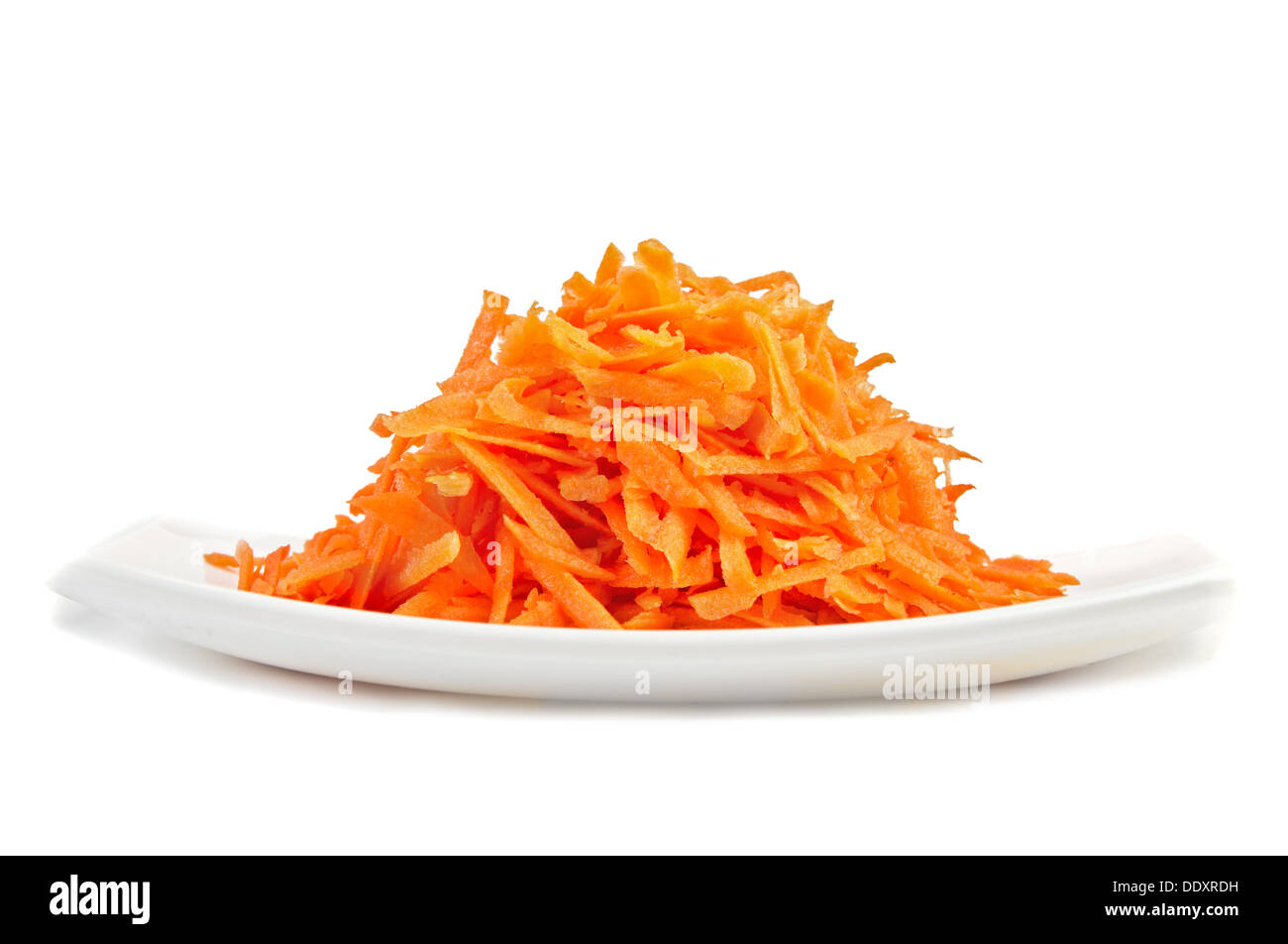 Grated carrots at plate isolated on white background Stock Photo - Alamy