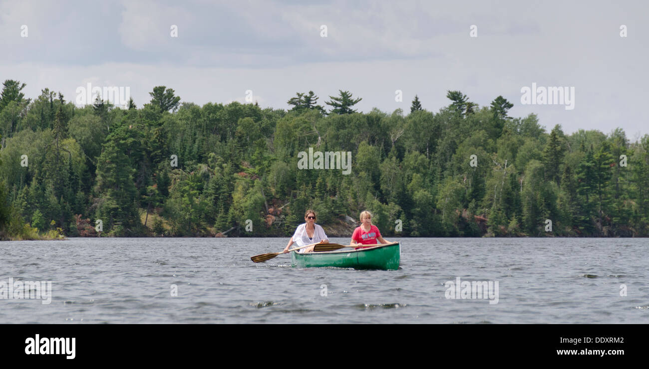 Two girls rowing boat in hi-res stock photography and images - Alamy