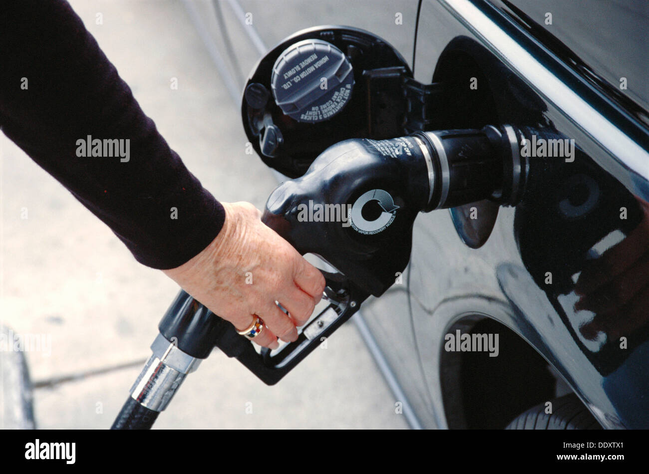 Black hand pumping gas hi-res stock photography and images - Alamy