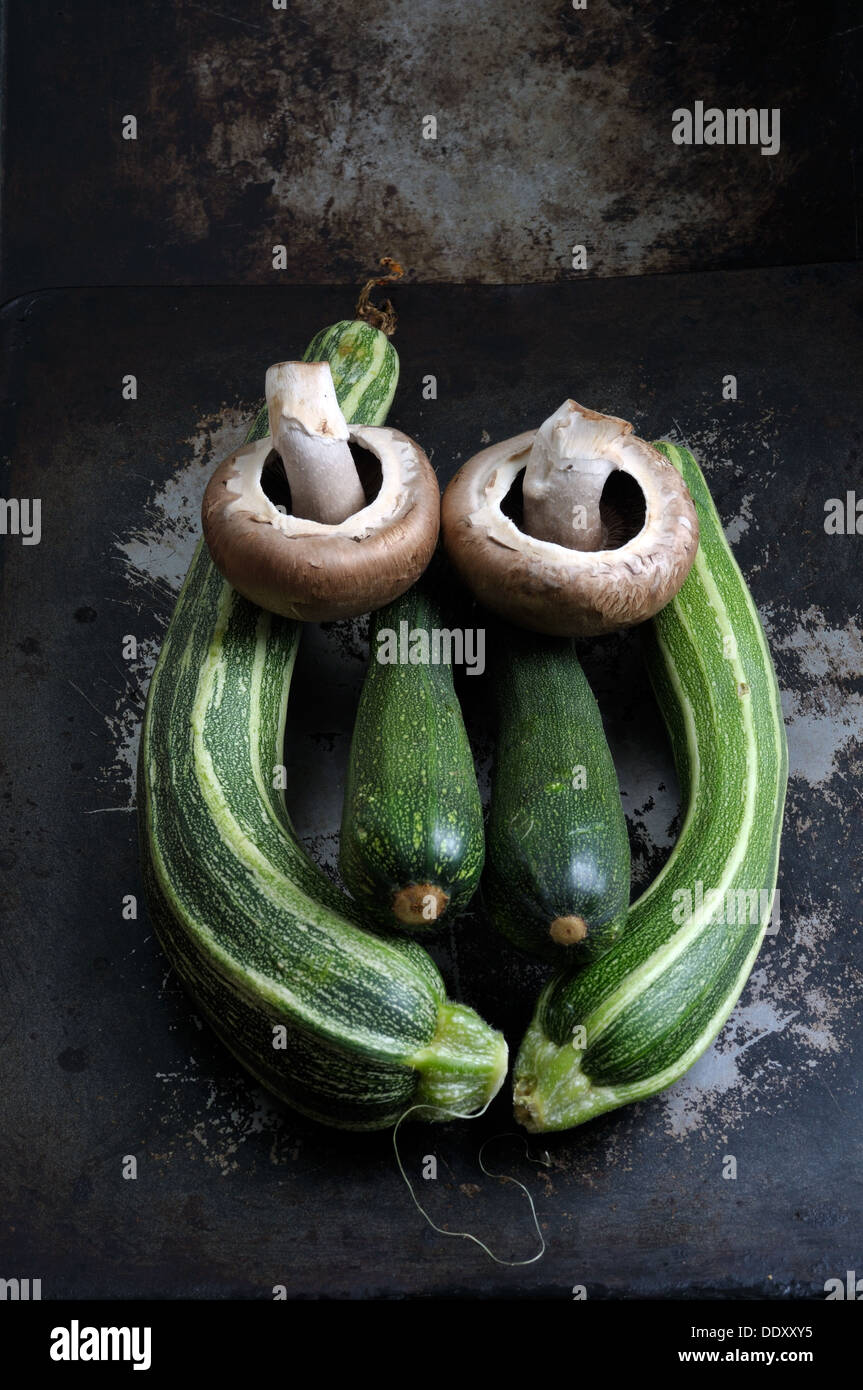 Zucchini courgette and mushroom face Stock Photo - Alamy
