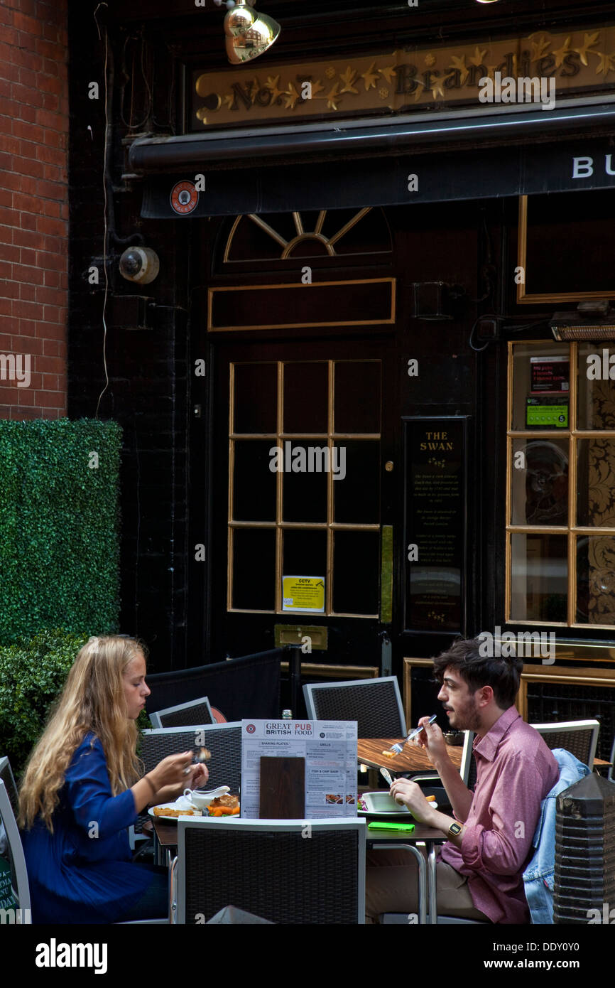 A Couple Enjoy Lunch at The Swan Public House, Bloomsbury, London ...