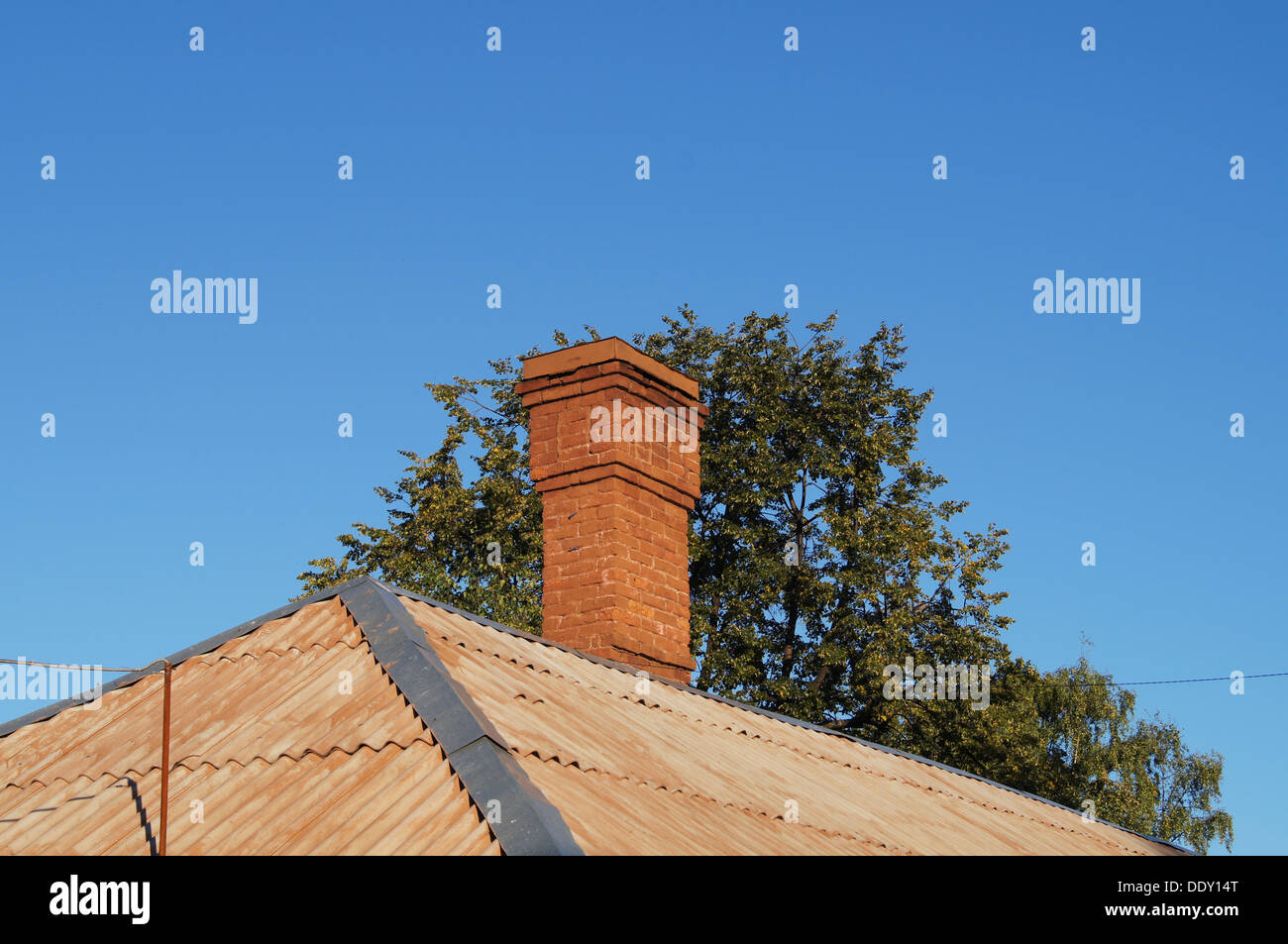 Bricks chimney on the roof Stock Photo - Alamy