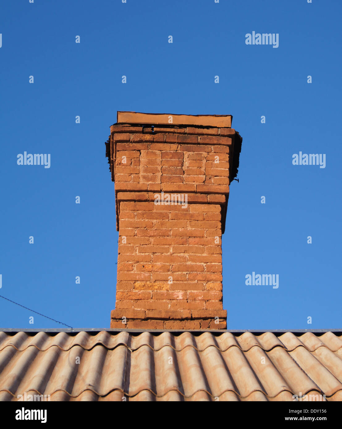 Bricks chimney on the roof Stock Photo - Alamy