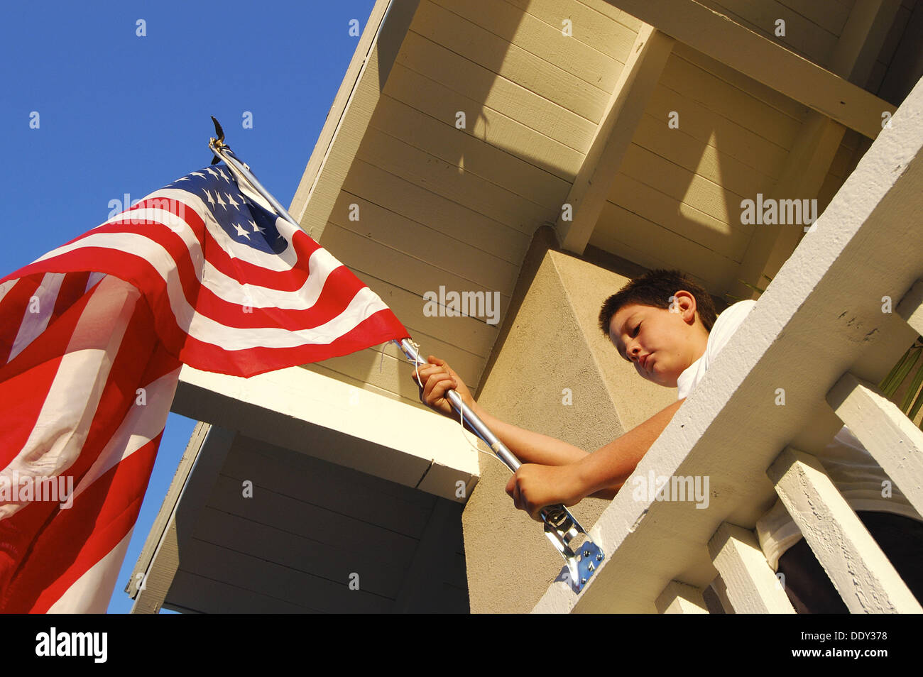Child raising flag pole hi-res stock photography and images - Alamy