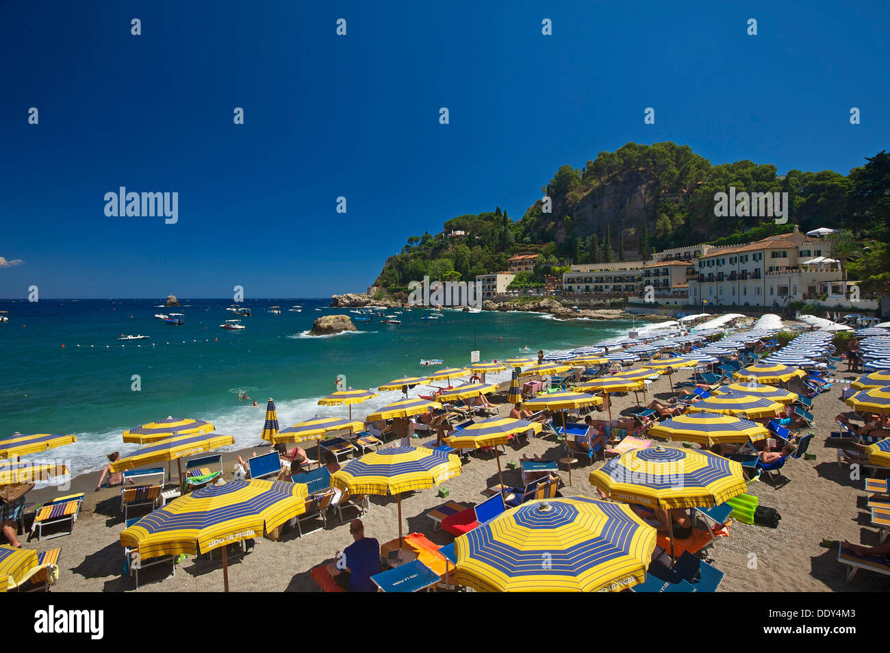 Tourists on the beach, umbrellas and sun loungers, Bay of Mazzarò ...