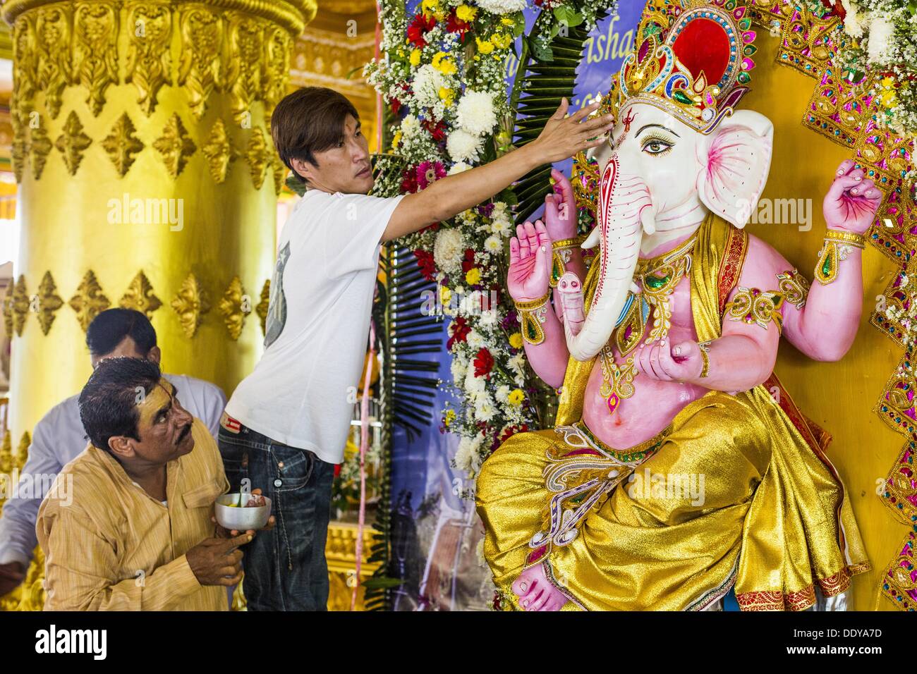 Bangkok, Thailand. 9th Sep, 2013. Hindus in Bangkok, Thailand, anoint a ...