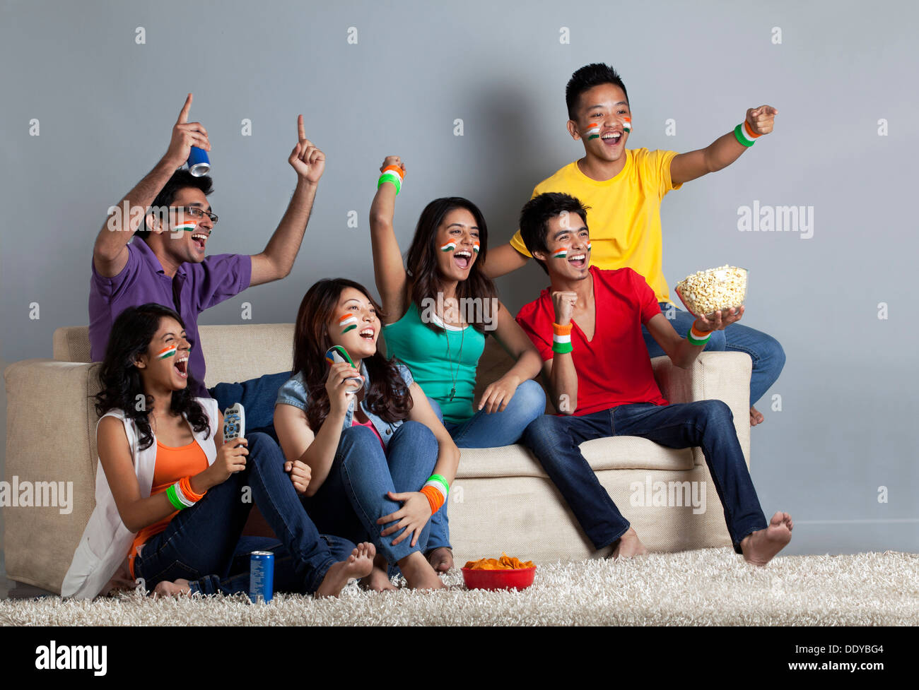 Excited young friends having great fun together at home Stock Photo - Alamy