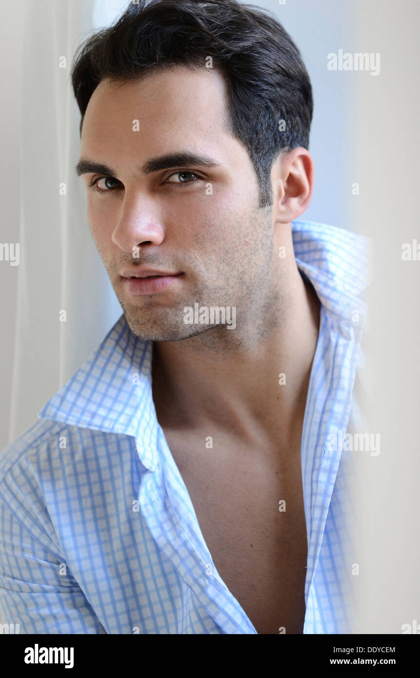 Man unbuttoned shirt during hi-res stock photography and images - Alamy