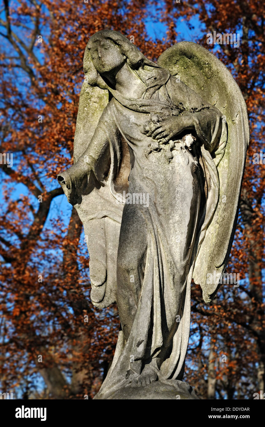 Weathered angel statue on the Ostfriedhof or East Cemetery, Munich ...