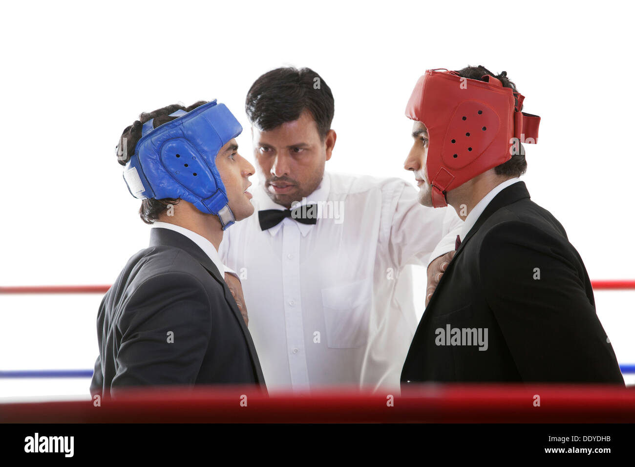 Referee separating boxers Stock Photo - Alamy