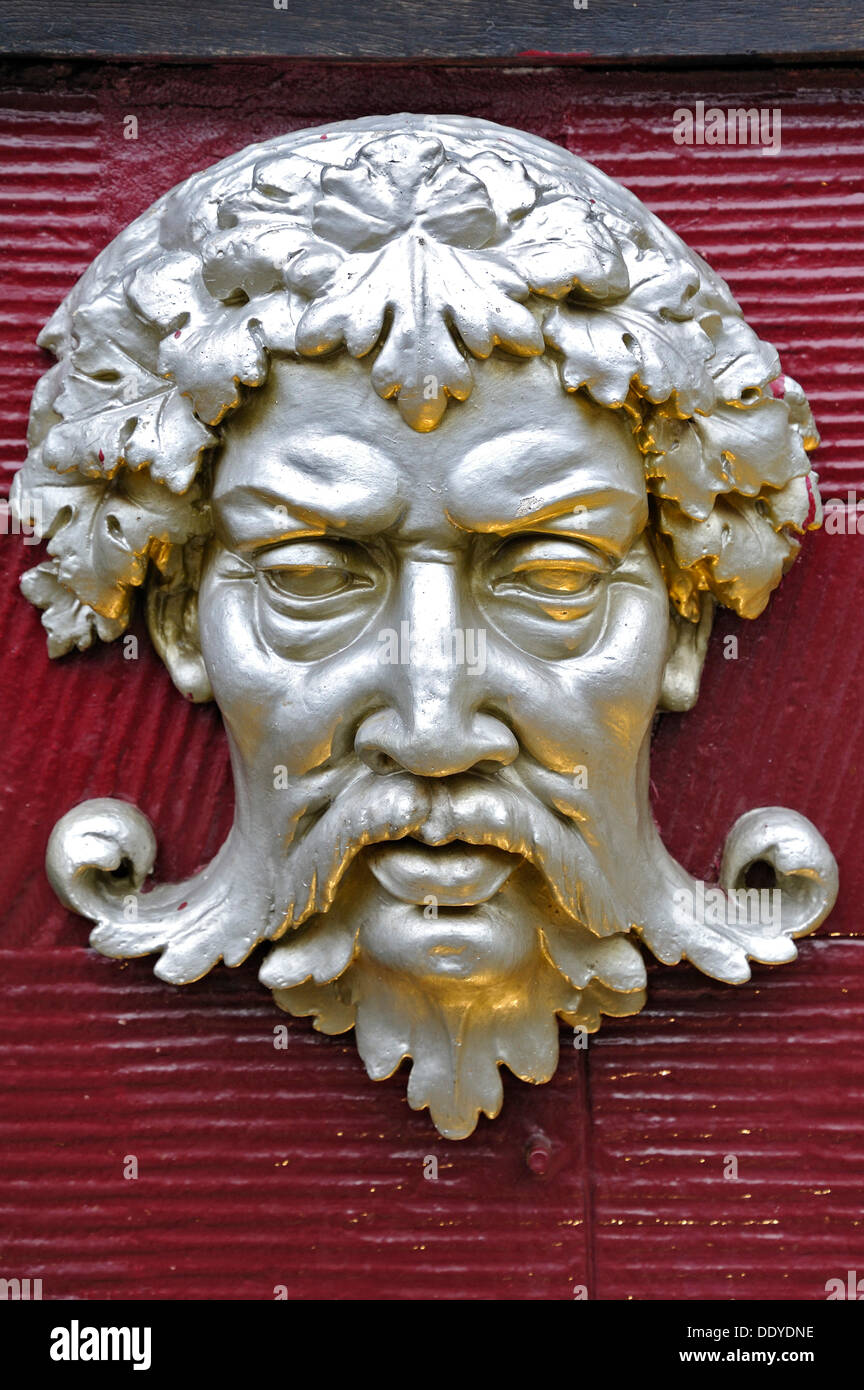 Bacchus, head of the Roman god on a wall Stock Photo - Alamy