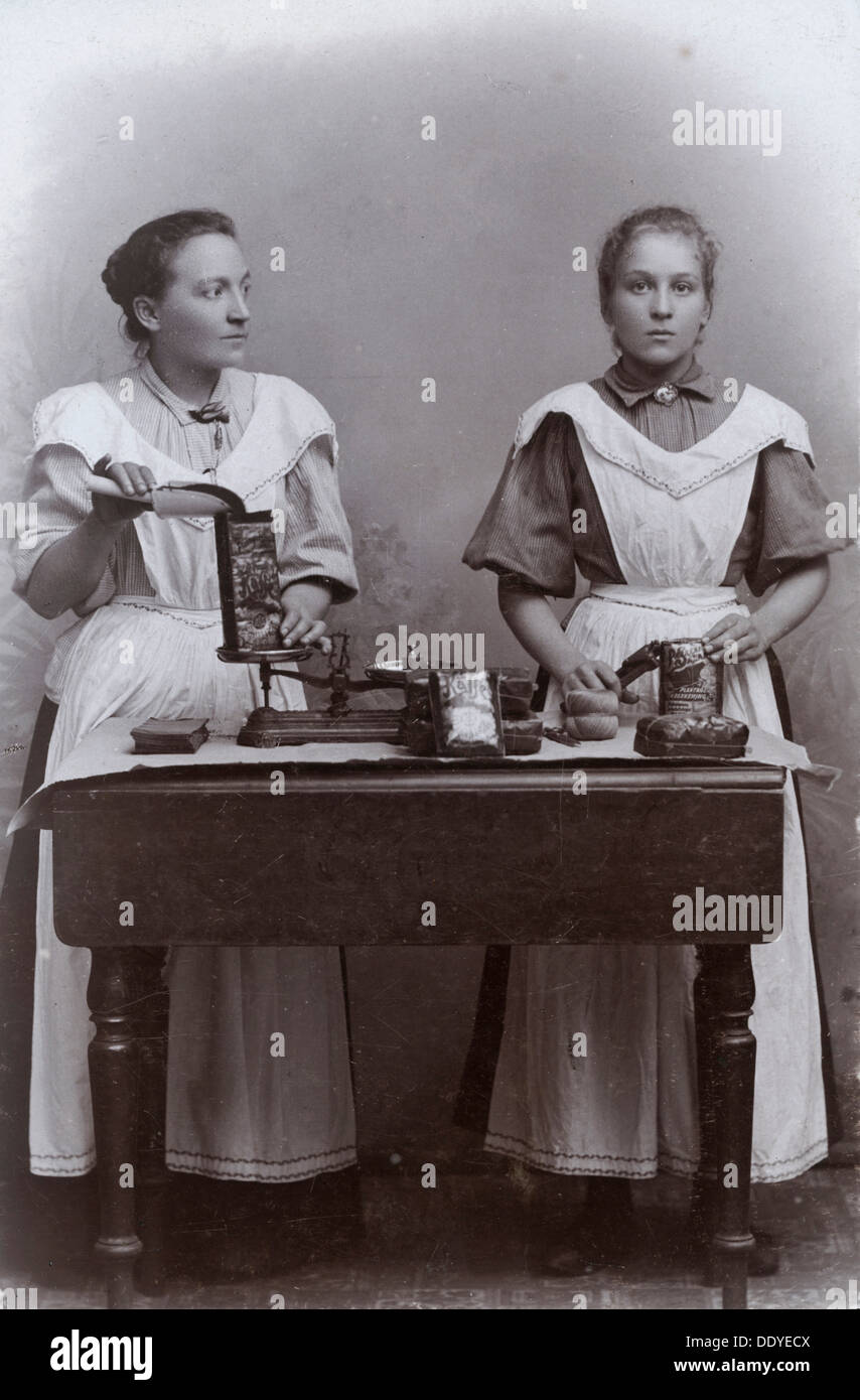 Two girls measuring coffee at the Dutch coffee shop, Landskrona, Sweden ...