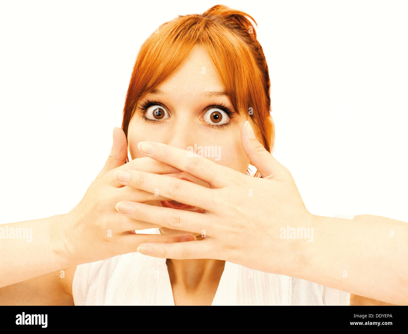 Frightened young woman holding both hands over her mouth Stock Photo ... Frightened young woman holding both hands over her mouth Stock Photo ...