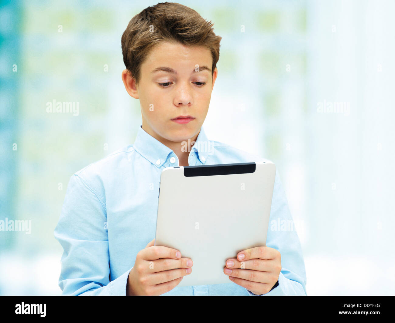Portrait, schoolboy, teenager with an iPad Stock Photo - Alamy