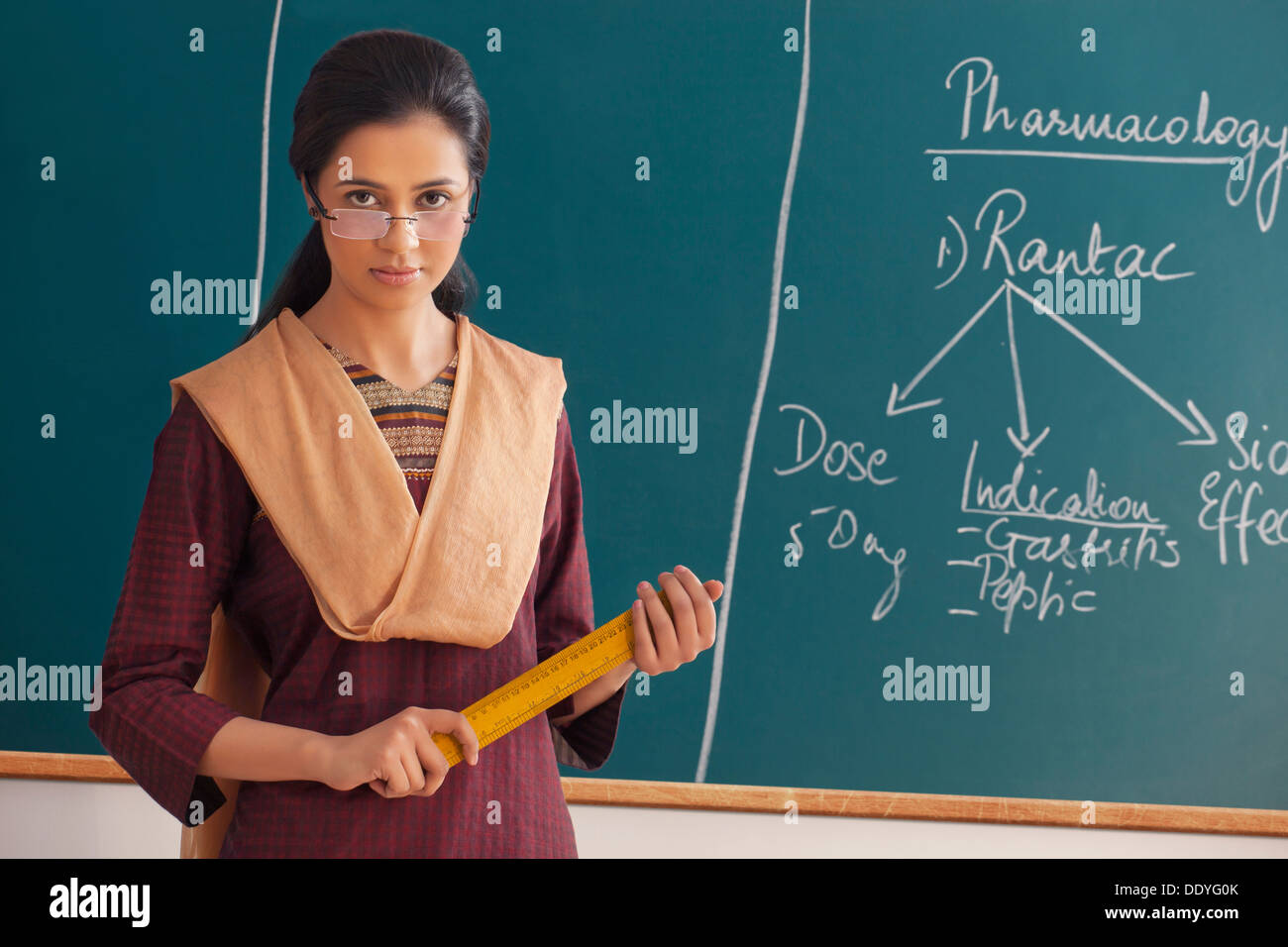 Female school teacher holding traditional hi-res stock photography and ...