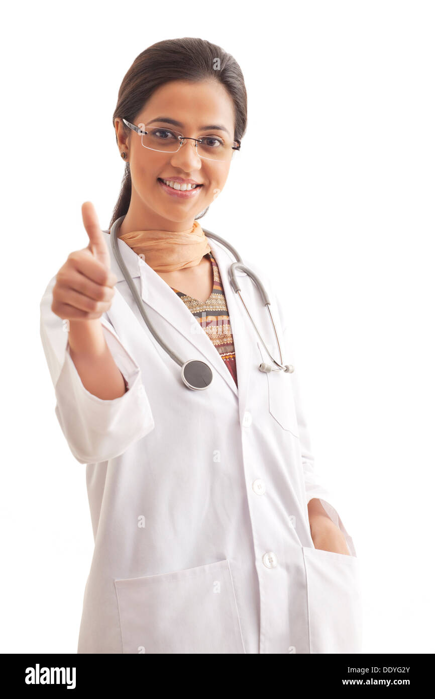 Portrait of female doctor showing thumbs up sign isolated over white ...