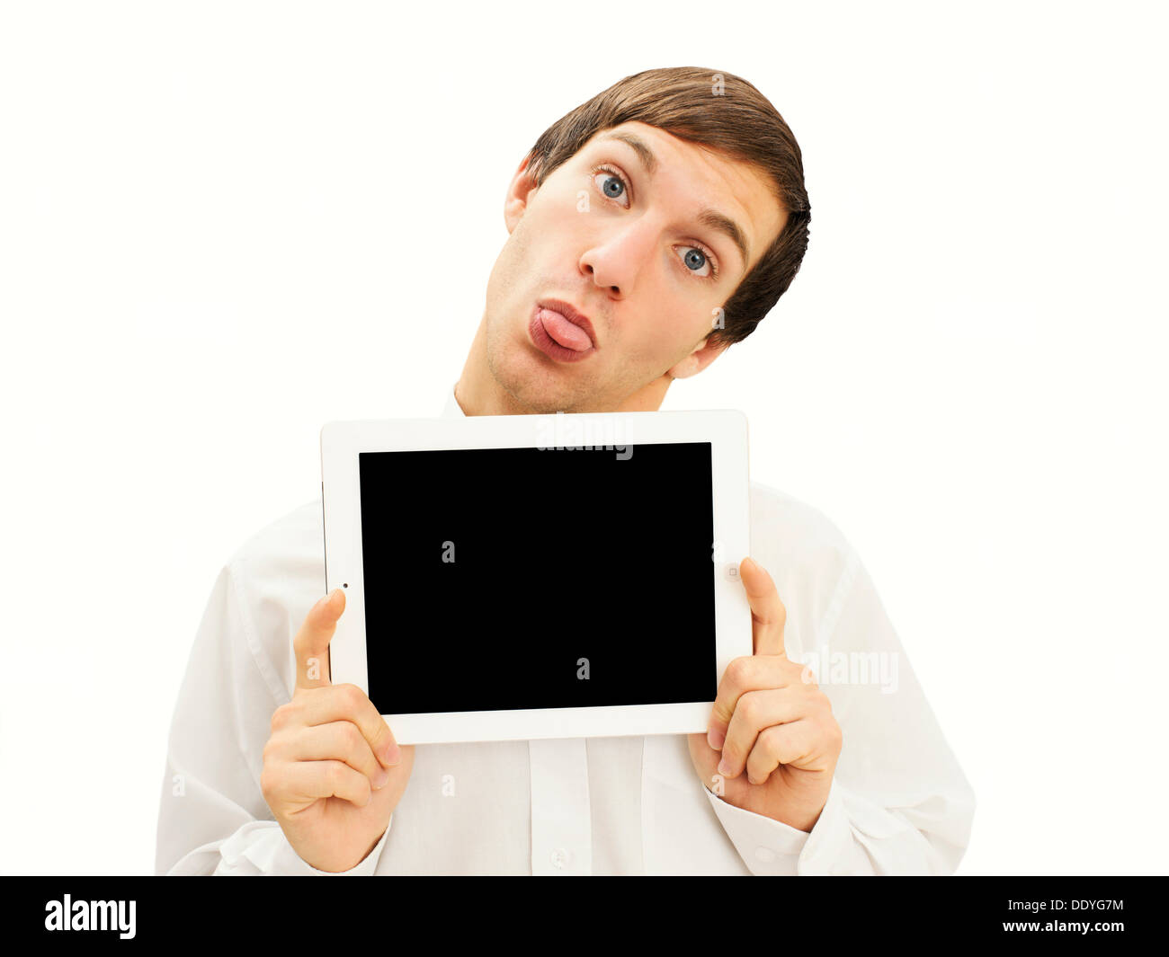 Cheeky man sticking out his tongue holding an iPad Stock Photo - Alamy
