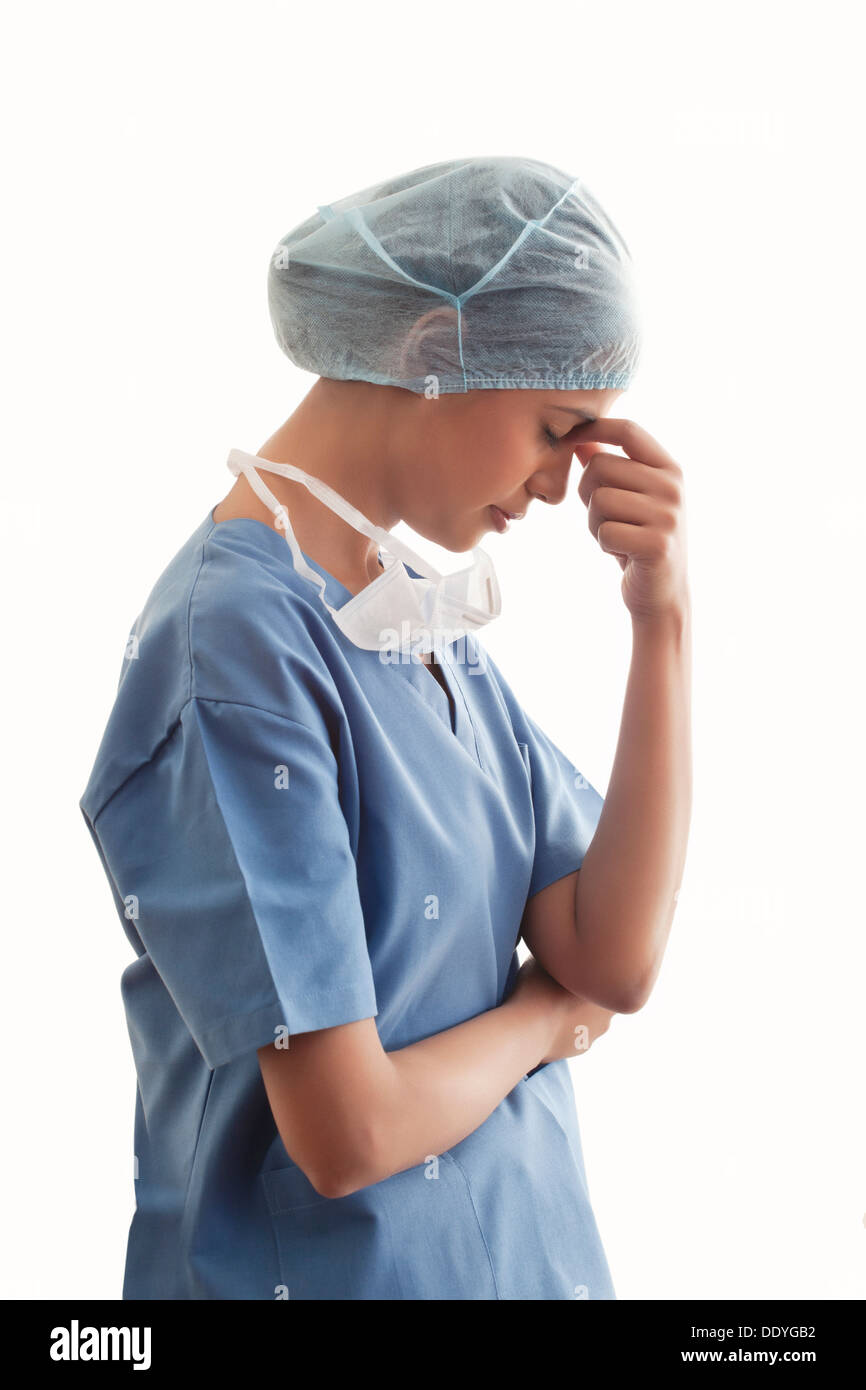 Stressed female doctor isolated over white background Stock Photo - Alamy