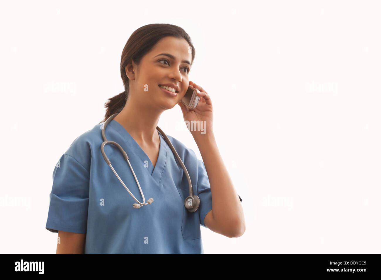 Young female surgeon on call isolated over white background Stock Photo ...