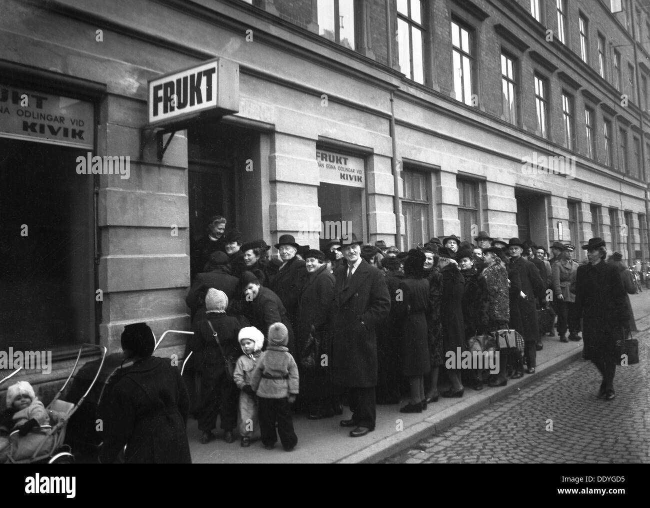 Long queue outside a shop selling fresh fruit, Malmö, Sweden, 1948 ...