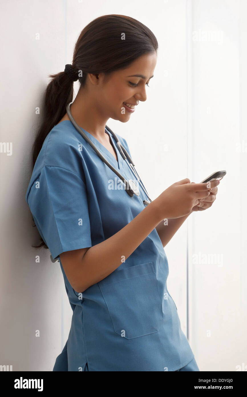 Smiling surgeon using cell hi-res stock photography and images - Alamy