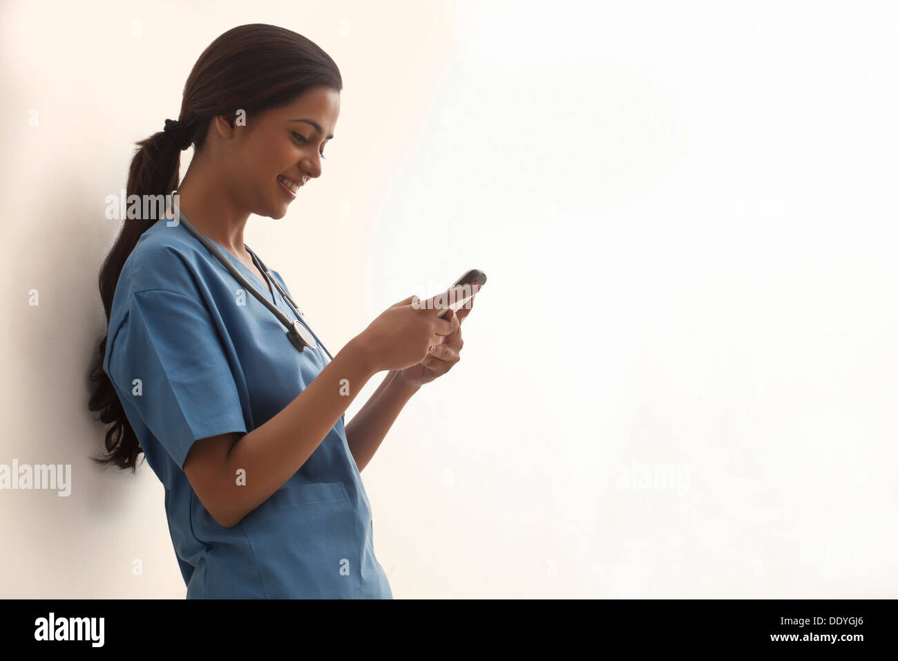 Smiling surgeon using cell hi-res stock photography and images - Alamy