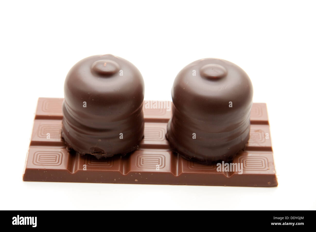 Froth kisses and nut chocolate Stock Photo - Alamy